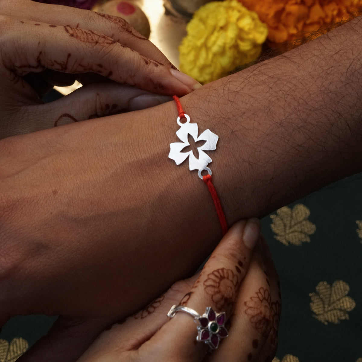 Silver Laser cut Flower Rakhi